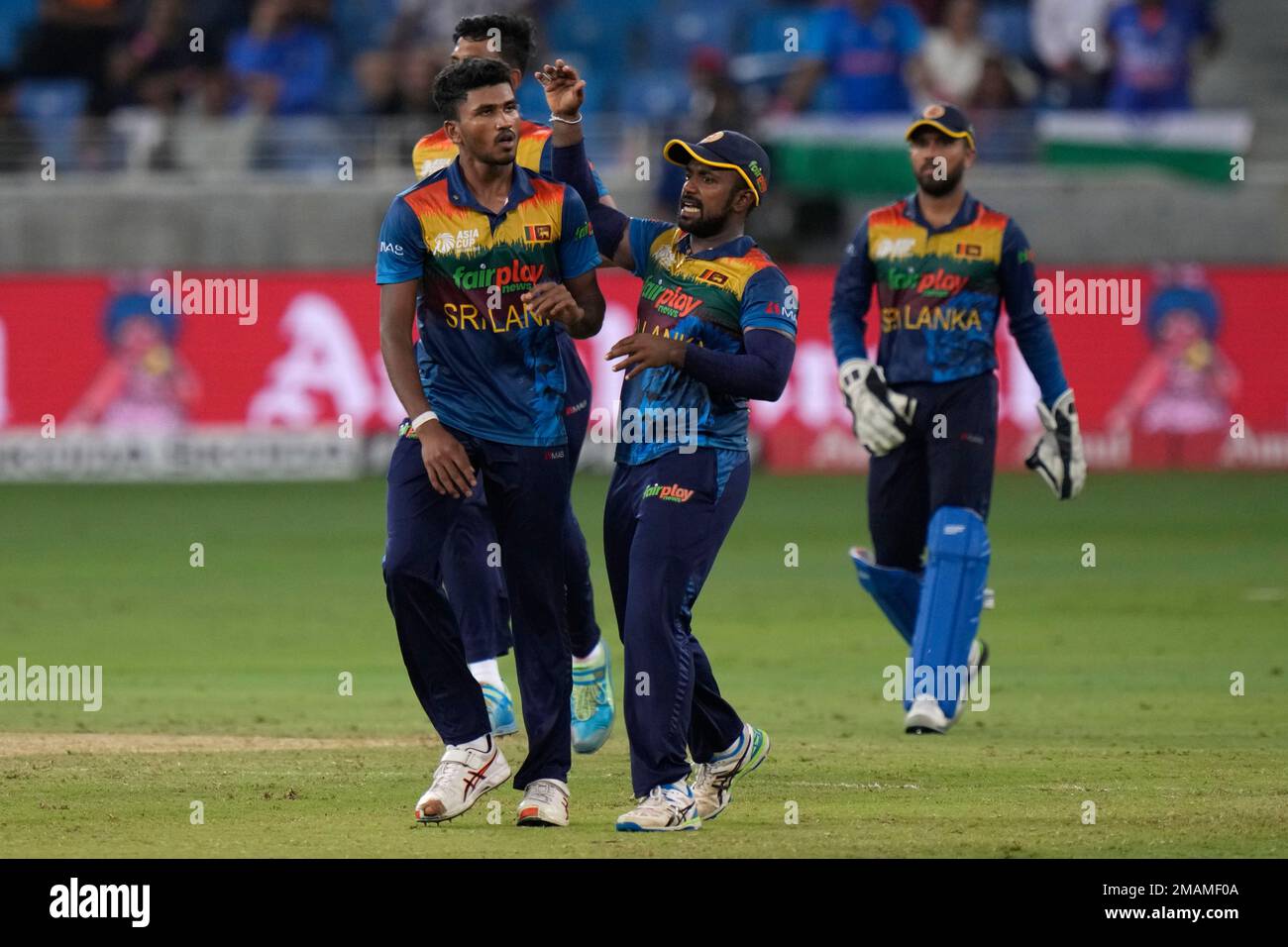 Sri Lanka's Dilshan Madushanka, left, celebrates with teammates the ...