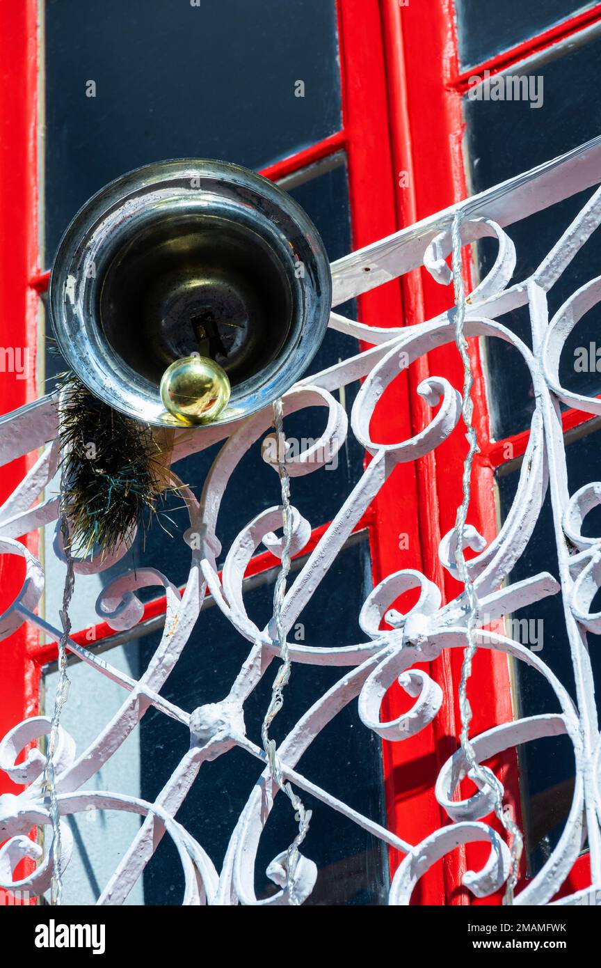 Christmas deco bell in a window with a bright, red frame Stock Photo ...