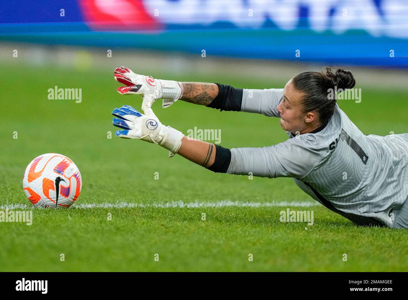 Canada's goalkeeper Kailen Sheridan dives to a make a save during a ...