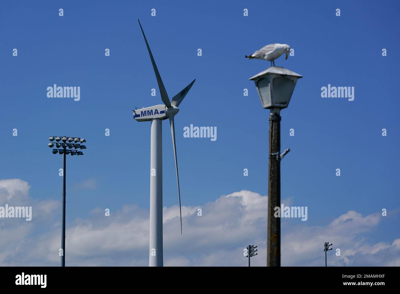 A wind turbine works on the campus of the Massachusetts Maritime ...