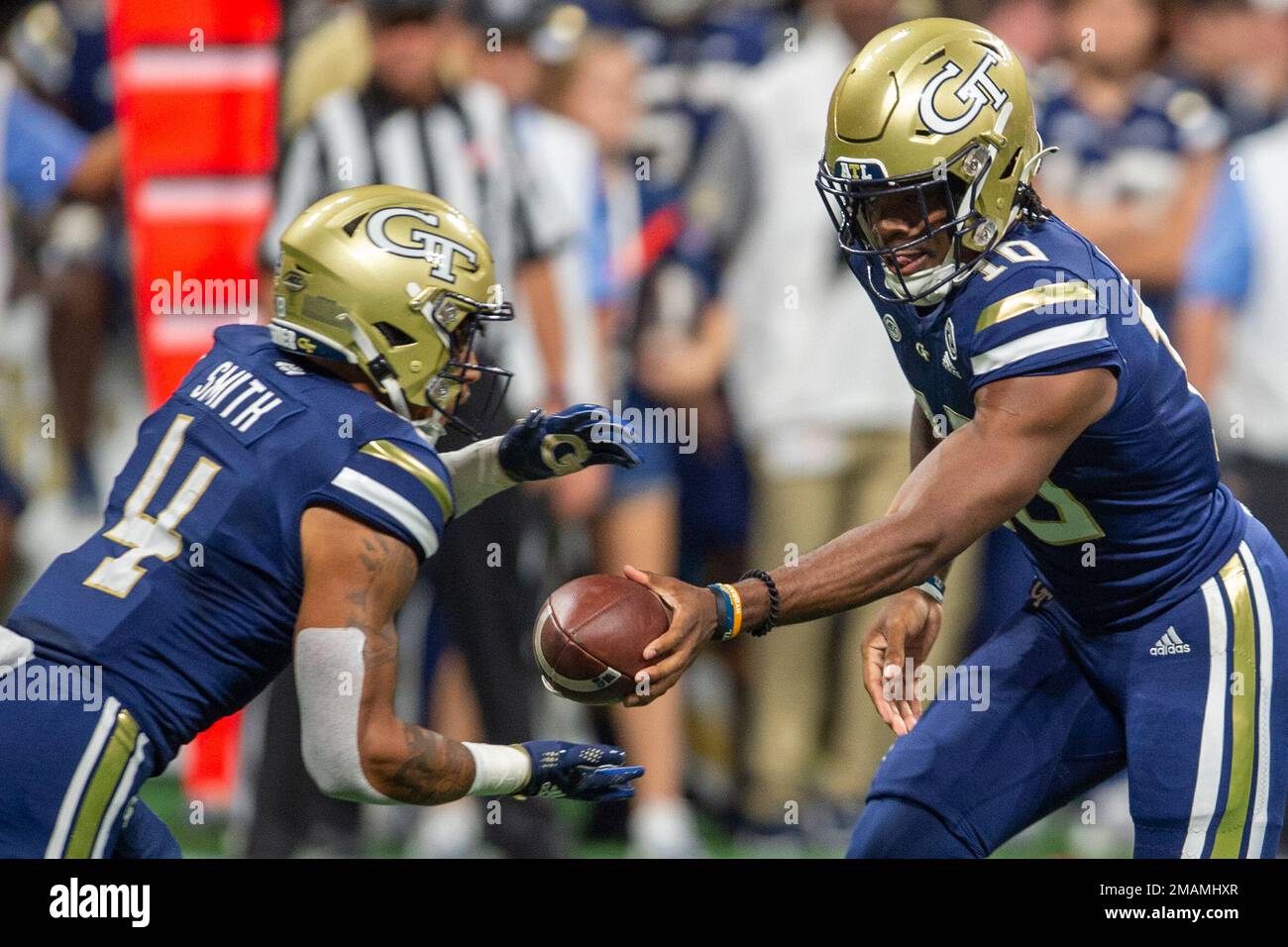 Georgia Tech quarterback Jeff Sims hands the ball off to Georgia Tech ...
