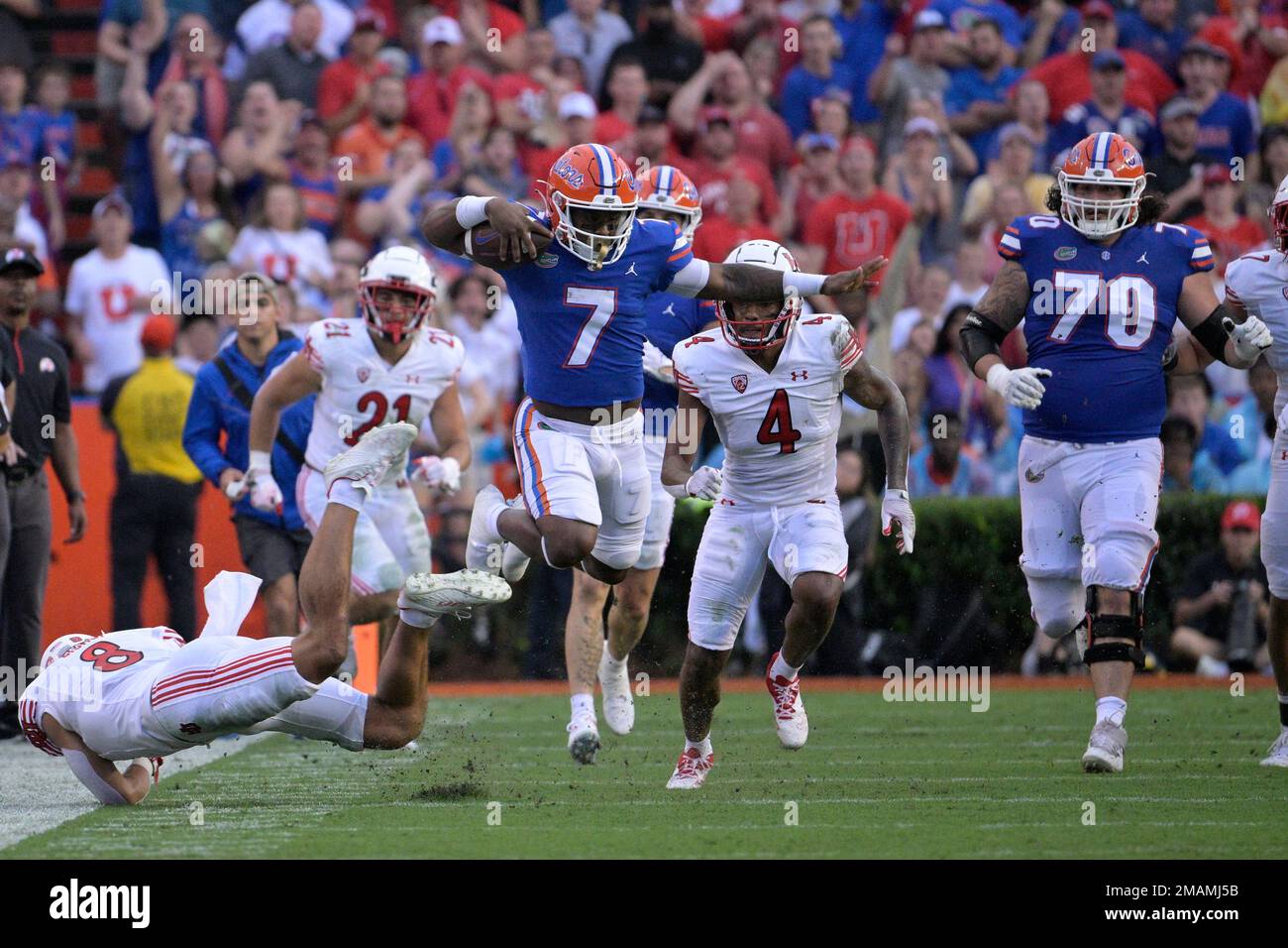 Florida running back Trevor Etienne (7) leaps over Utah safety Cole ...
