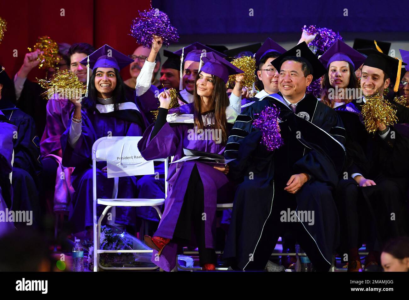 Model and author Emily Ratajkowski (c) seen sitting after delivering ...
