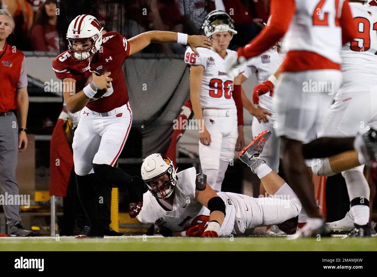 Wisconsin's Graham Mertz (5) runs past Illinois State's Noah Hickcox ...