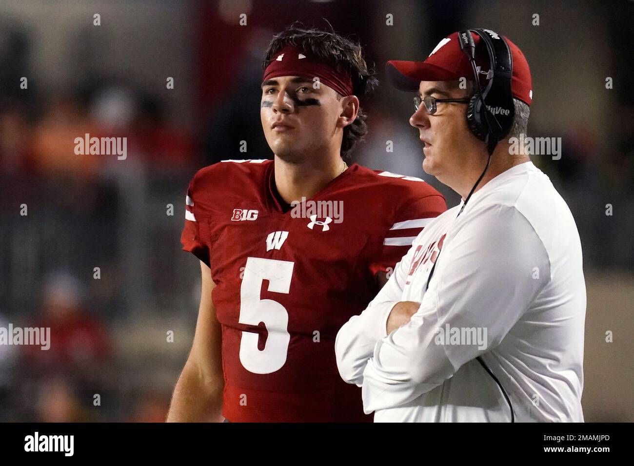 Wisconsin's Graham Mertz (5) talks with head coach Paul Chryst during ...