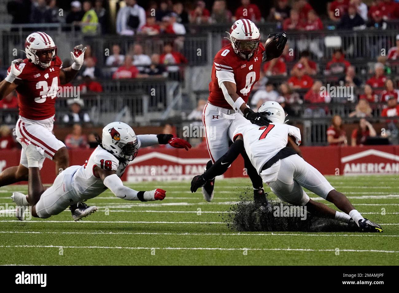 Wisconsin's Braelon Allen (0) runs between Illinois State's Jeremiah ...