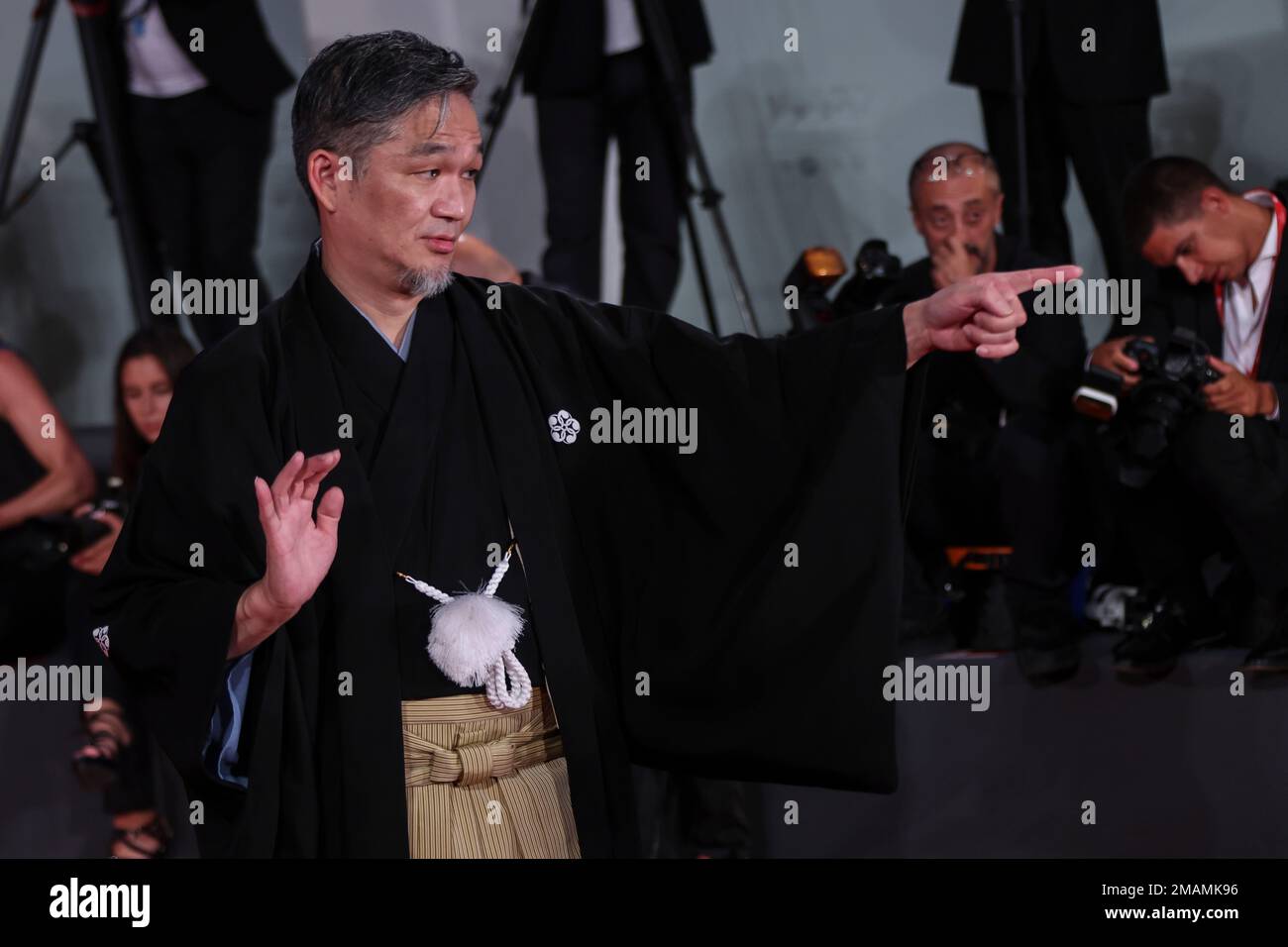 Atom Sunada poses for photographers upon arrival at the premiere of the ...