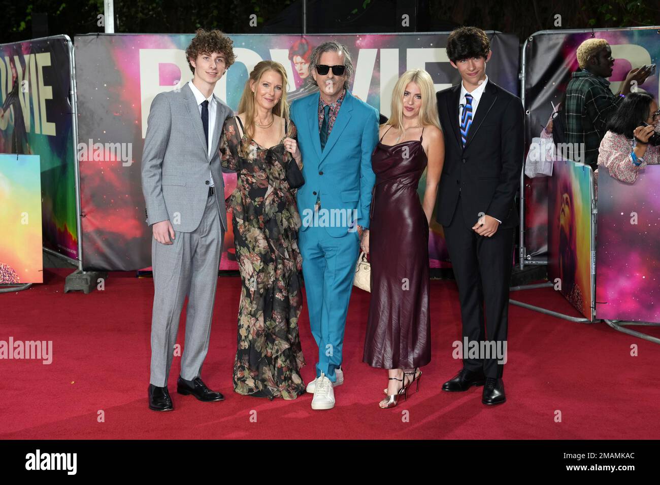 Director Brett Morgen, middle, and Debra Eisenstadt pose with guests ...