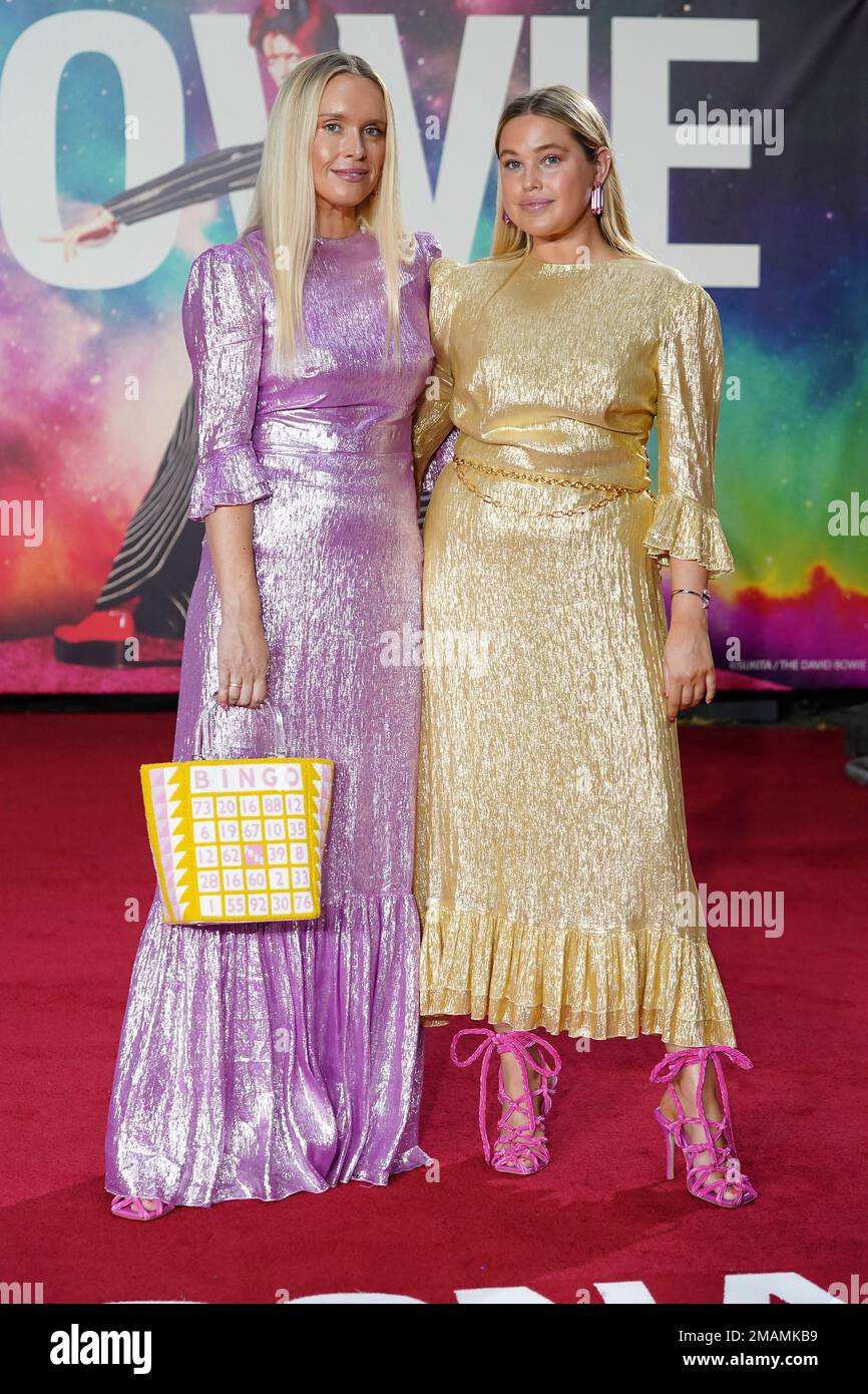 Olivia Minns, left, and Alice Minns pose for photographers upon arrival ...