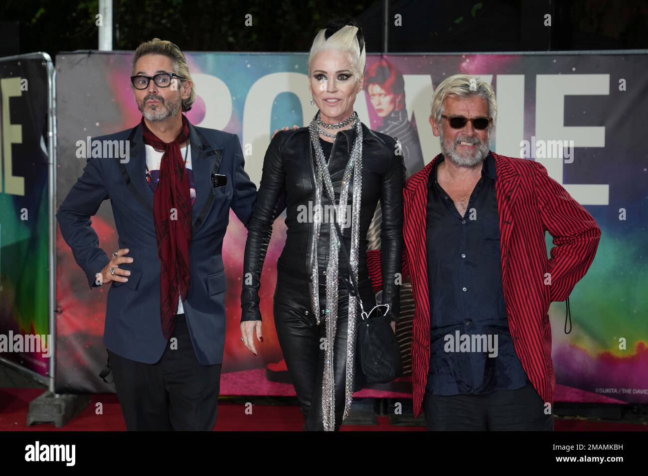 Malcolm Doherty, left and Daphne Guinness pose with a guest for ...