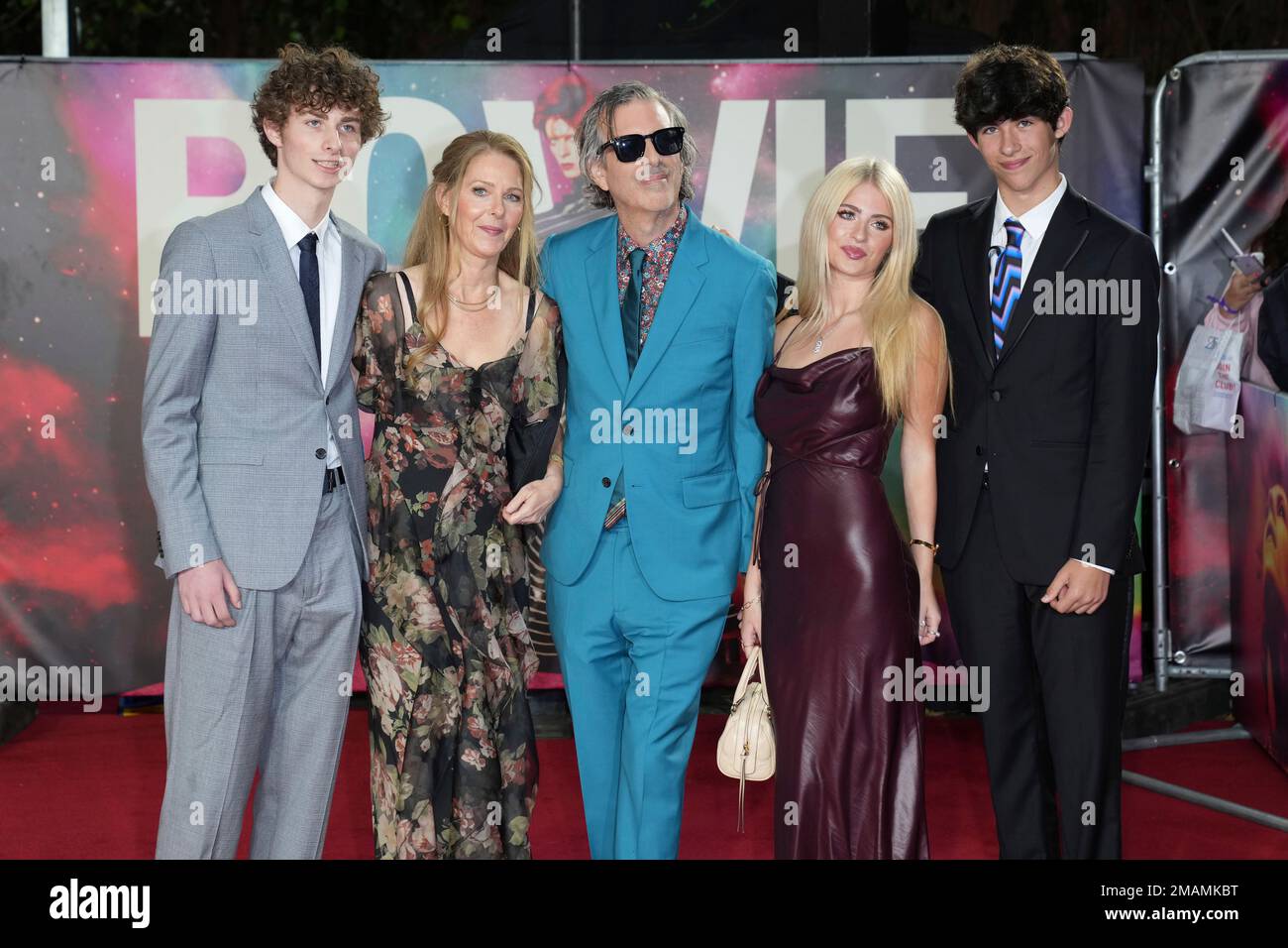 Director Brett Morgen, middle, and Debra Eisenstadt pose with guests ...