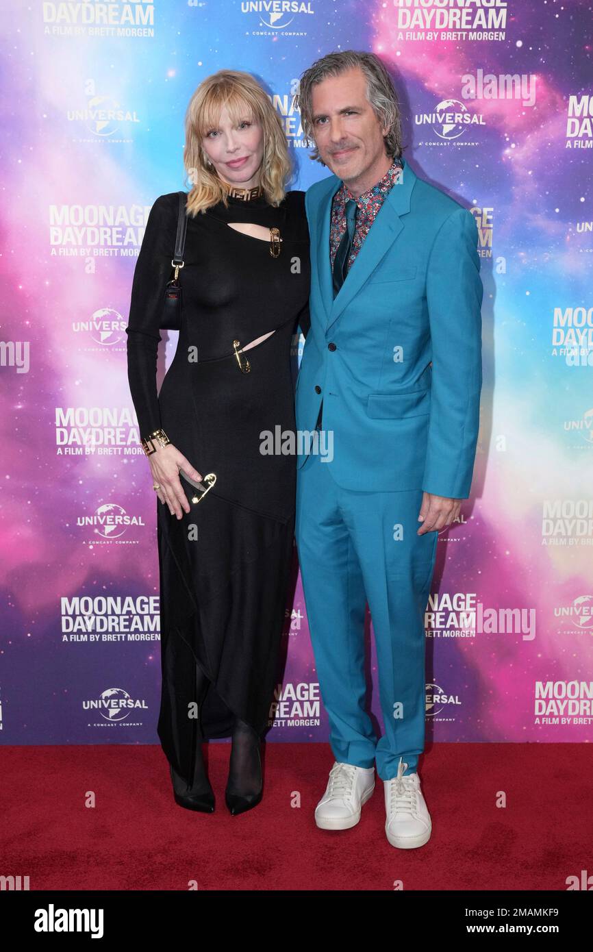 Courtney Love, left, and Director Brett Morgen pose for photographers ...