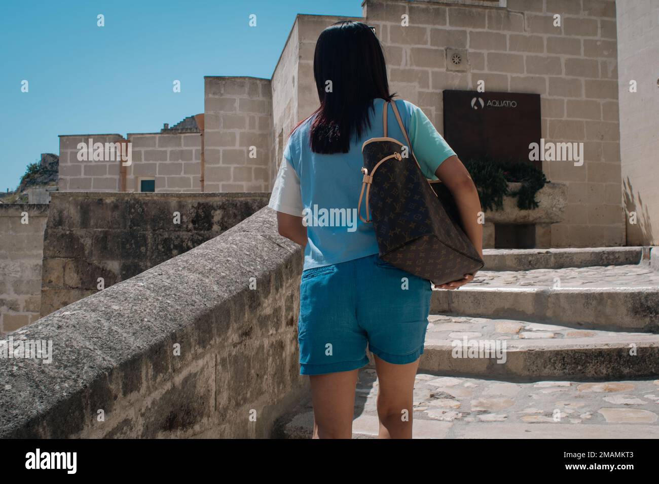 People enjoying daily life and sights in the Italian town of Matera ...