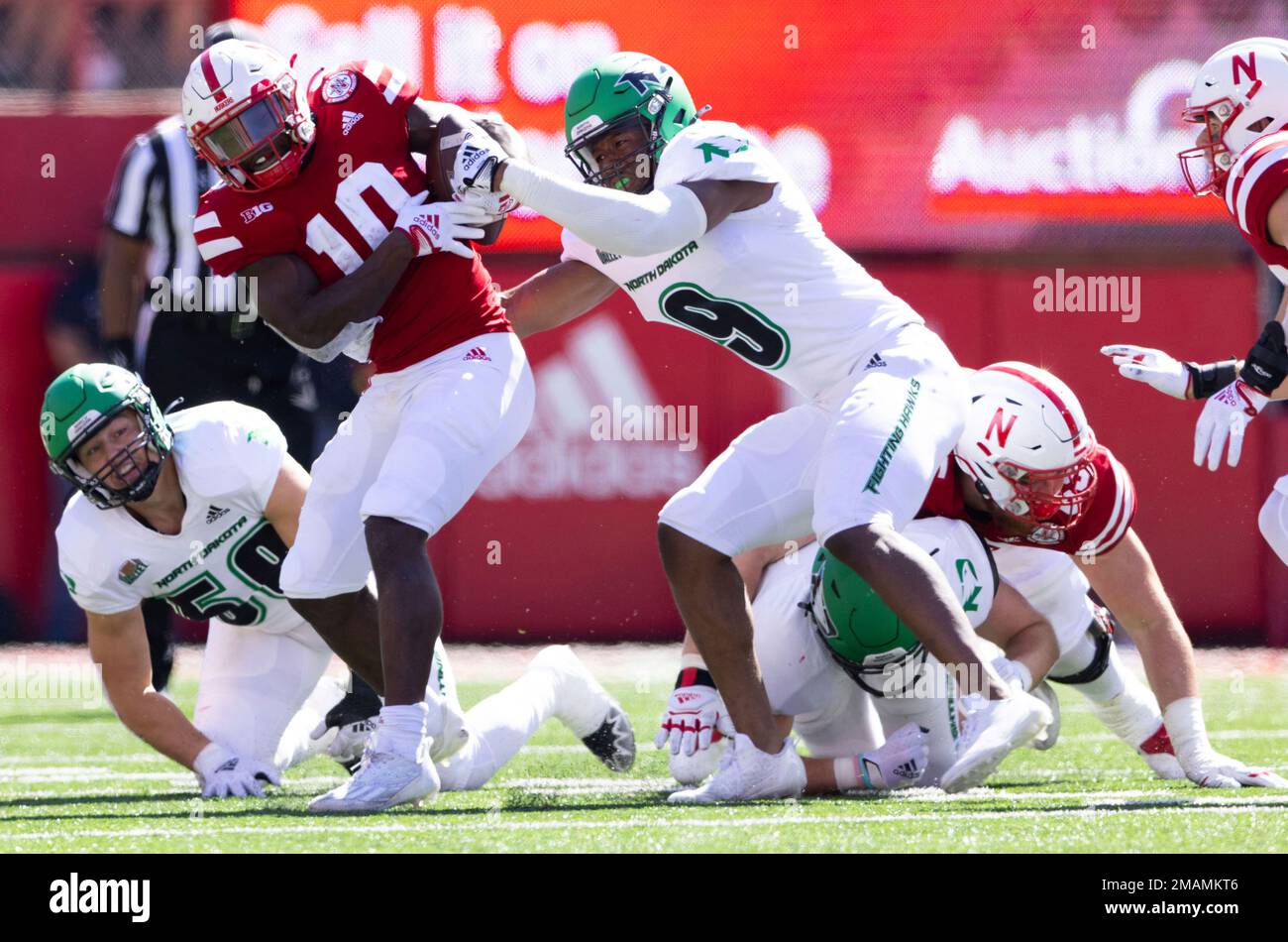 Nebraska's Anthony Grant (10) rushes against North Dakota's Marcus ...