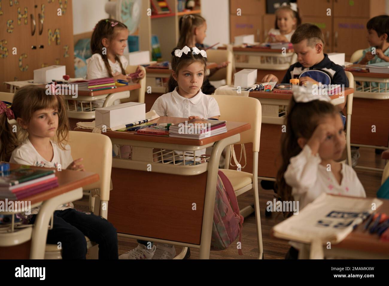 Ukrainian refugee children sit in a classroom at the Ienachita ...