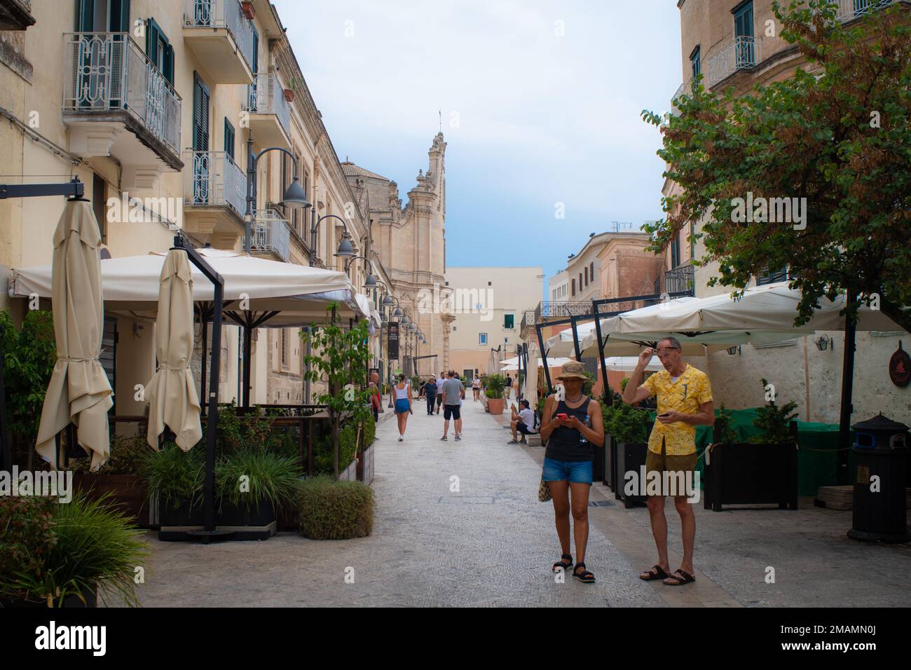 People enjoying daily life and sights in the Italian town of Matera ...