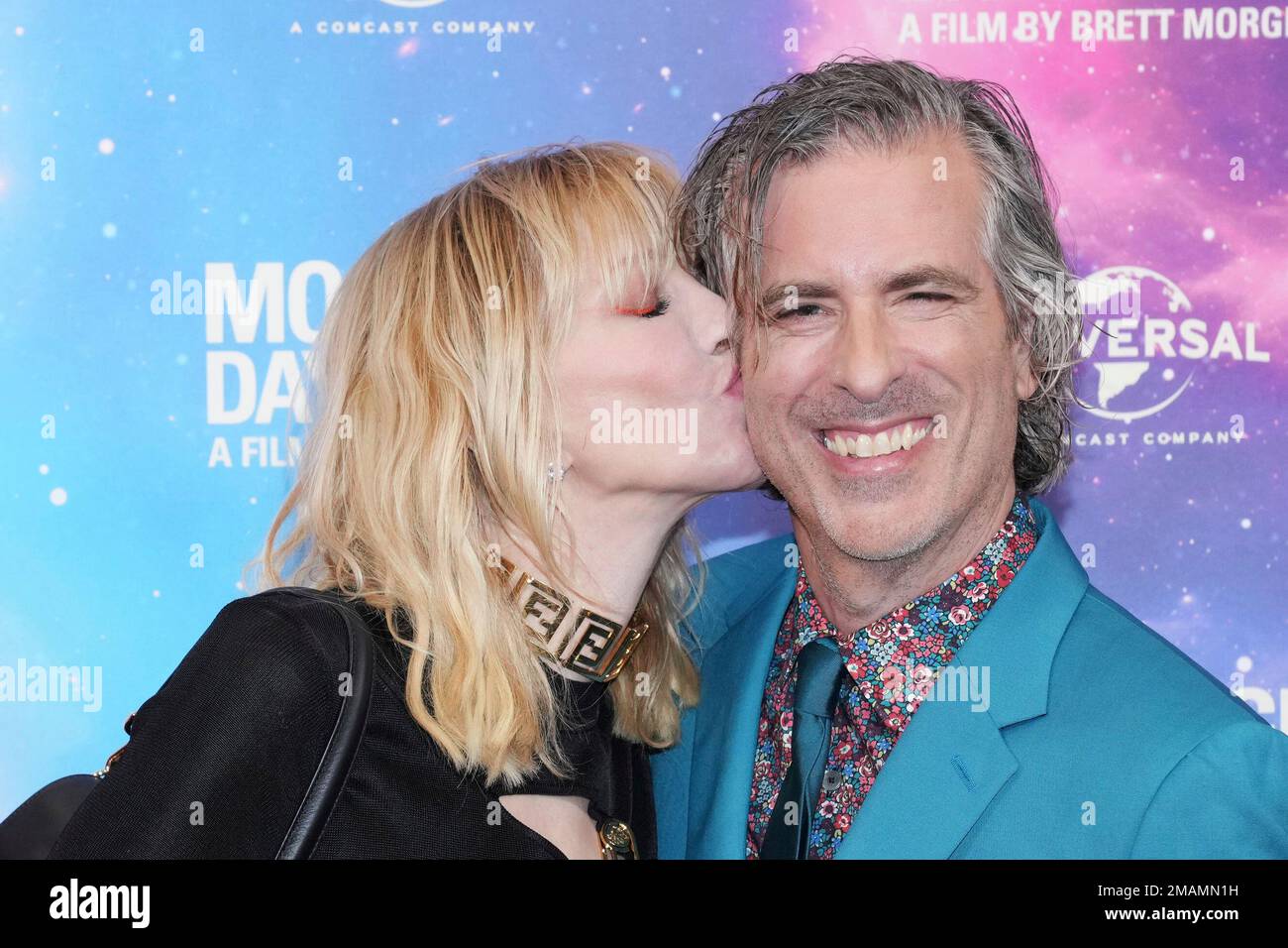 Courtney Love, left, and Director Brett Morgan pose for photographers upon arrival at the London ...