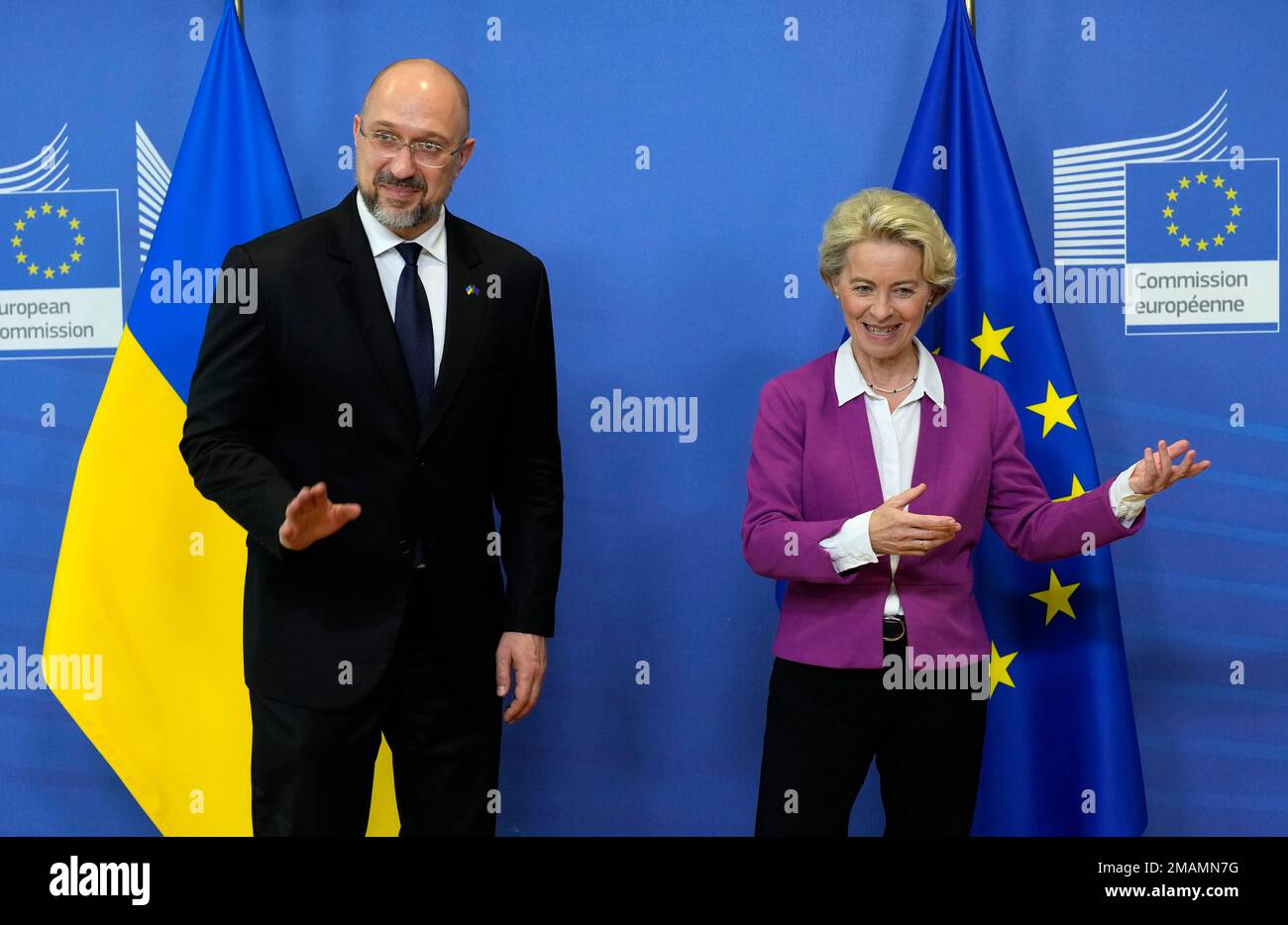 Ukrainian Prime Minister Denys Shmyhal, left, is greeted by European ...