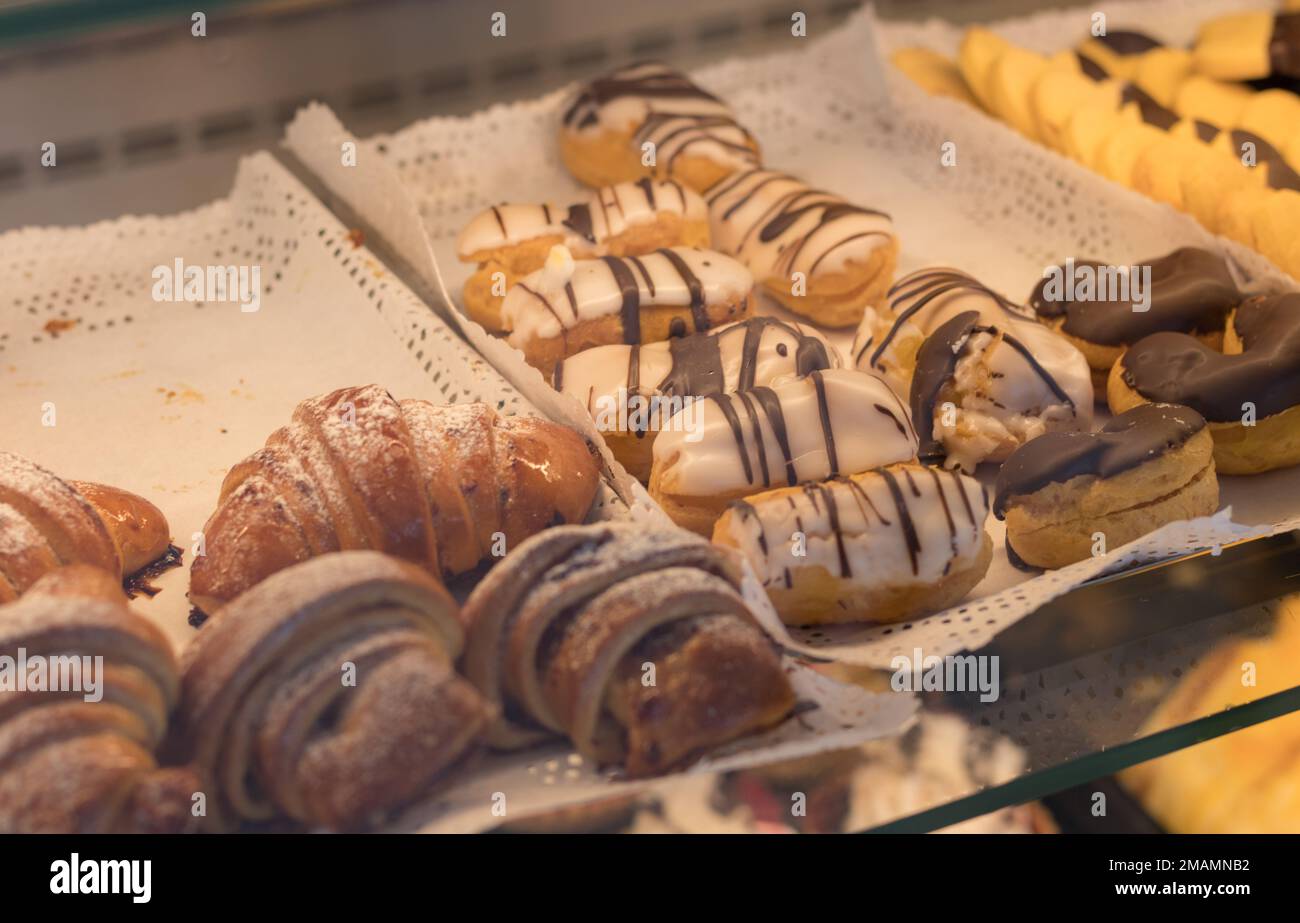 Chocolate croissants and other pastries on the counter in the pastry ...