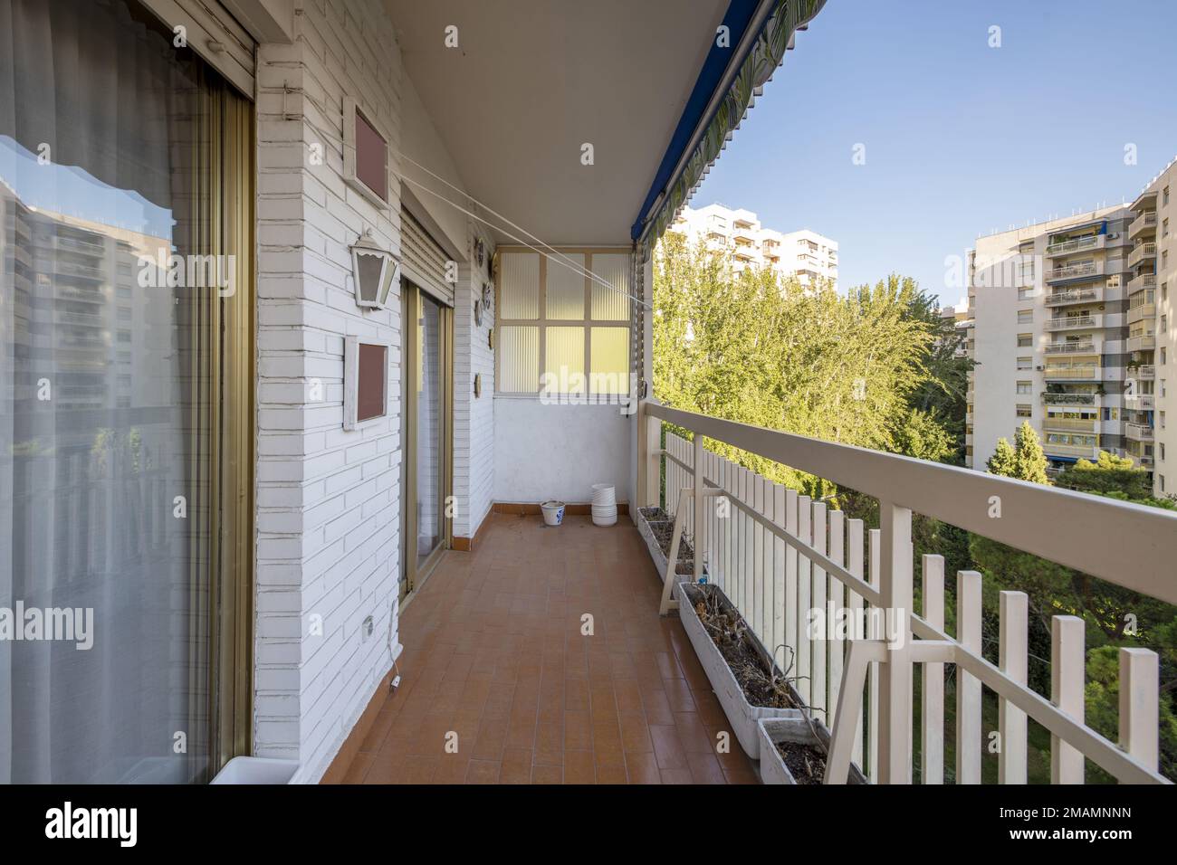 Open terrace of a house in a residential building with white painted ...