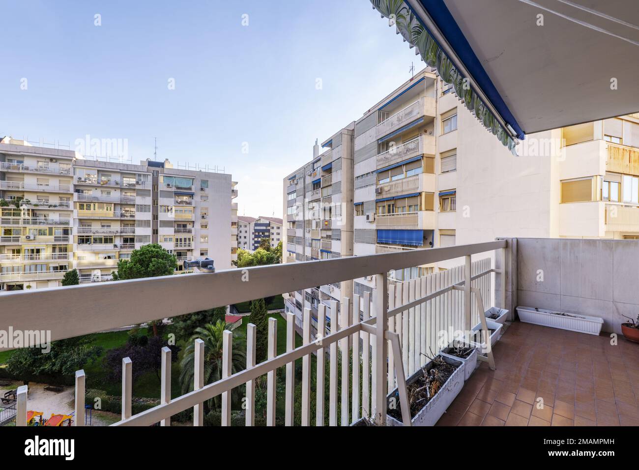Open terrace of a house in a residential building with white painted ...