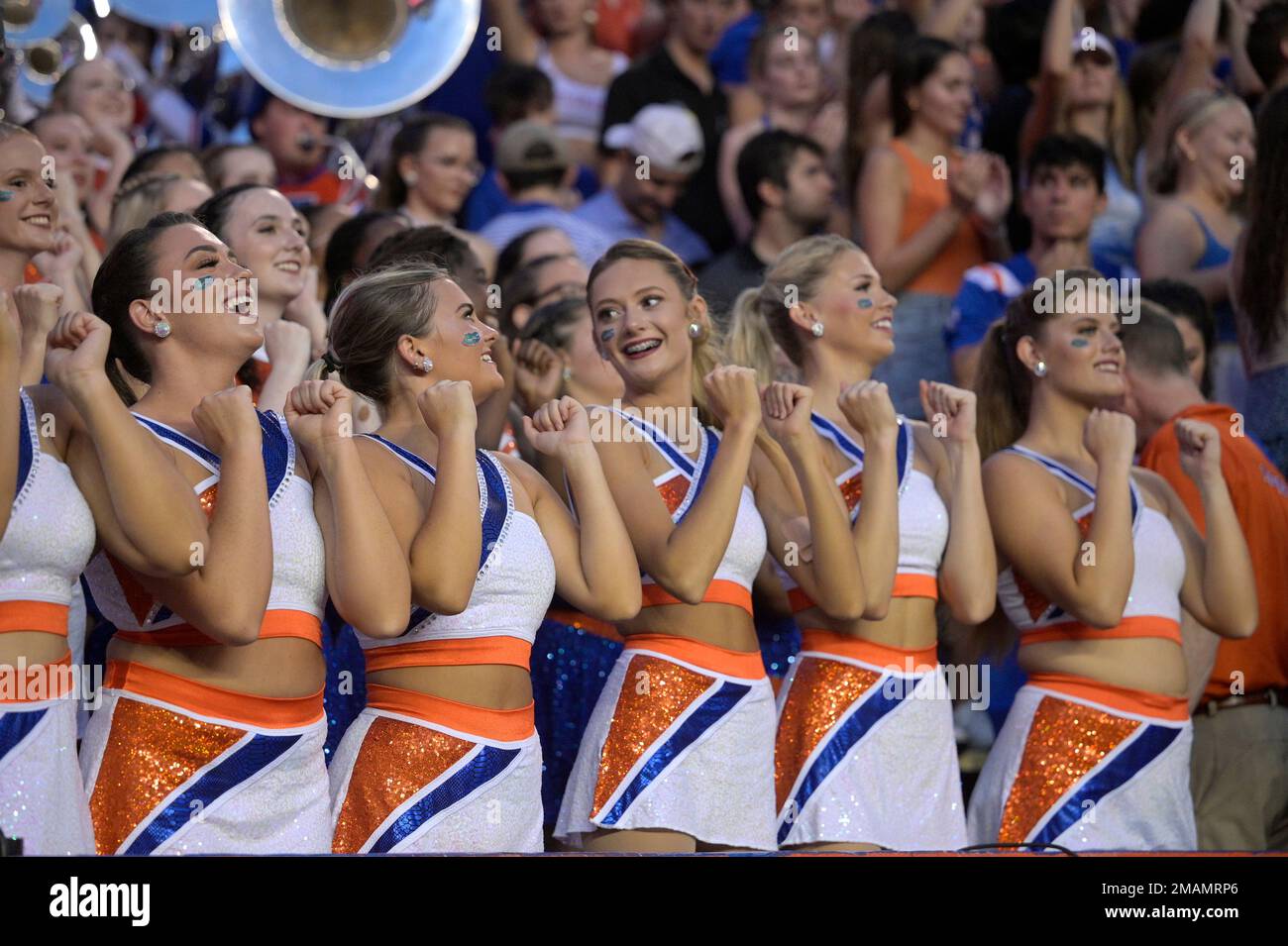 Members of the Florida marching band twirlers perform in the stands ...