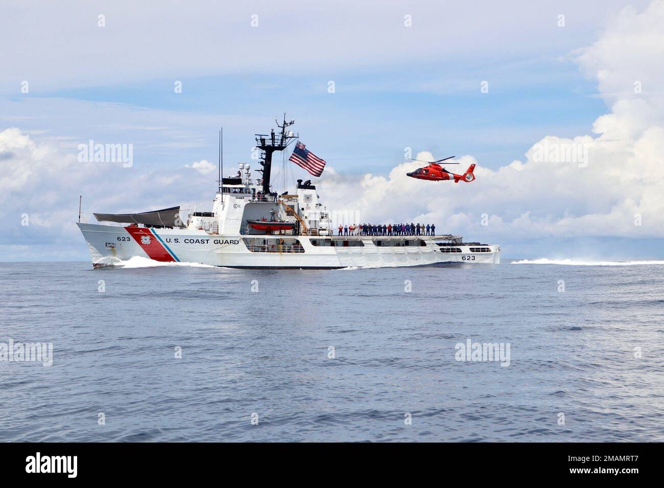 The crew of U.S. Coast Guard Cutter Steadfast stands in formation on ...