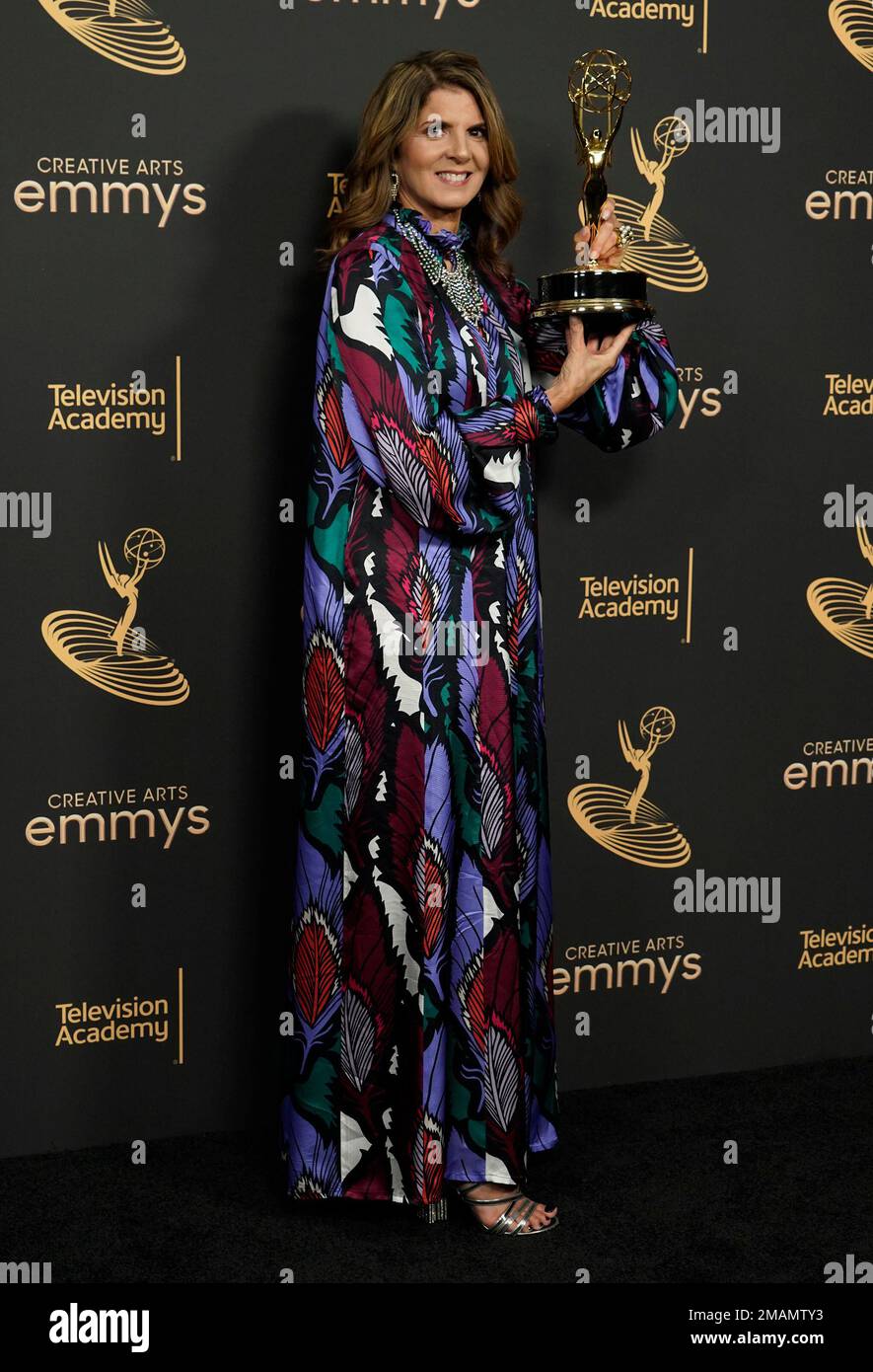 Nora Felder poses in the press room with the award for outstanding ...
