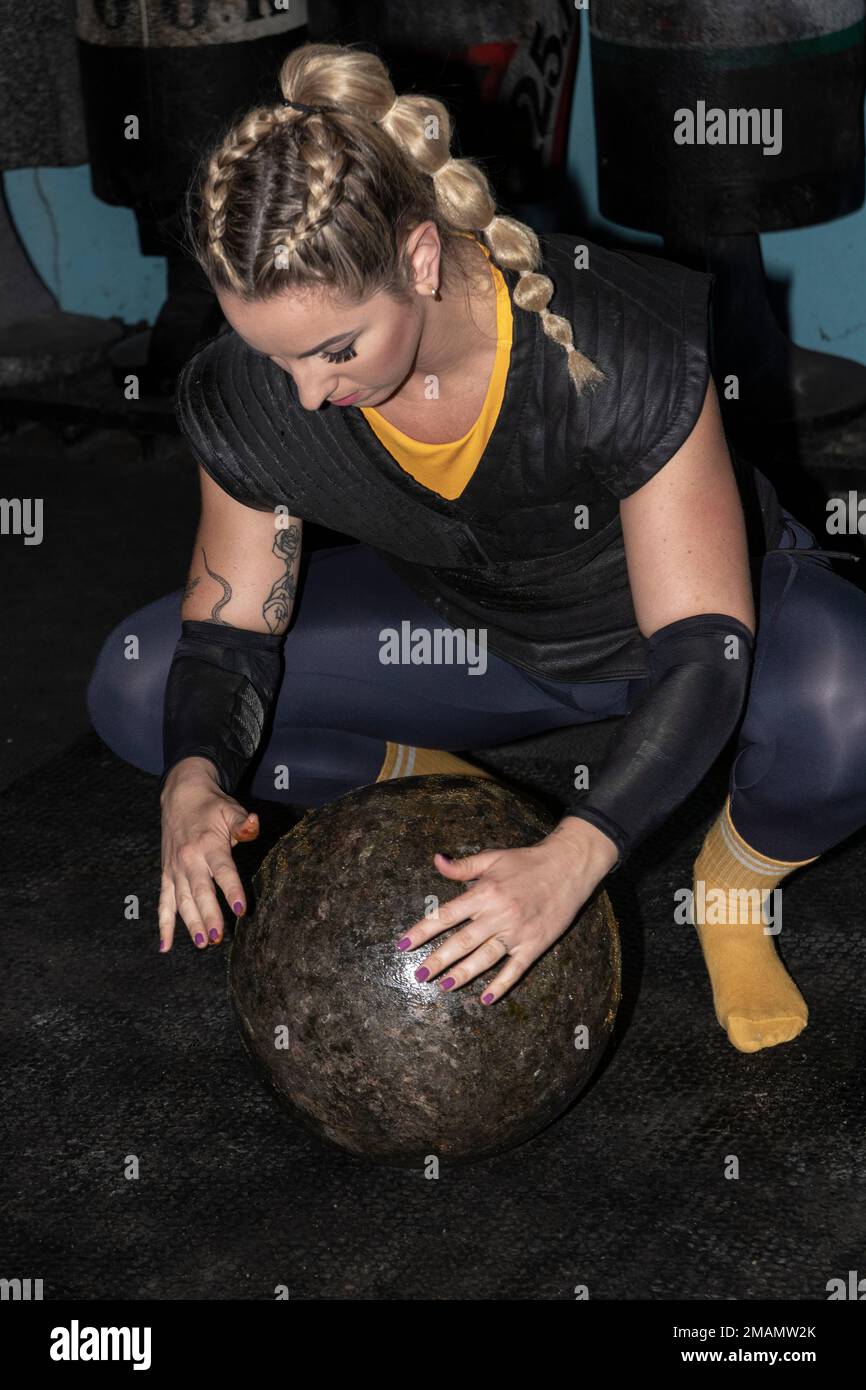 woman from the basque country practicing the rural sport of stone ...