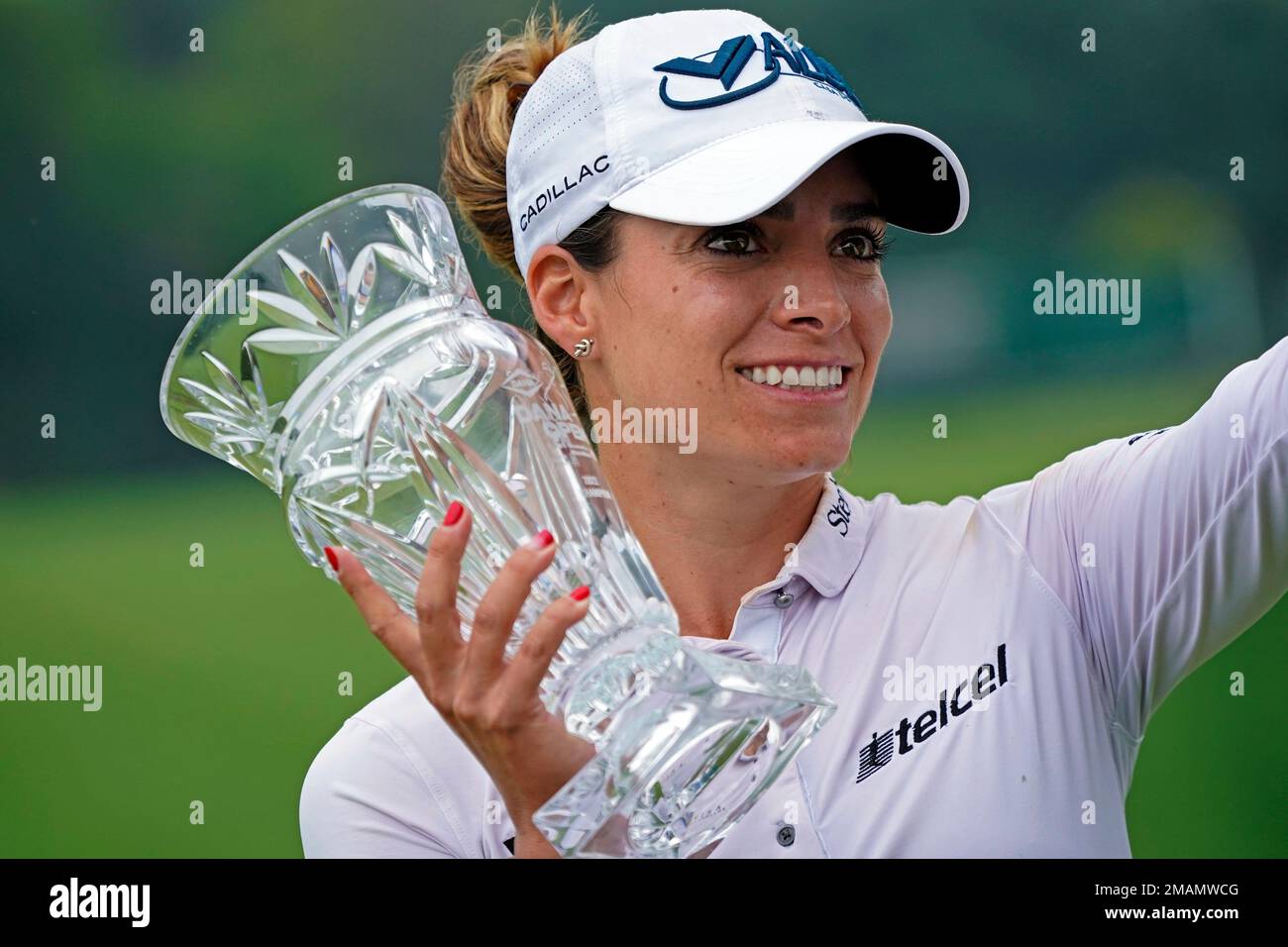 Gaby Lopez of Mexico poses with her trophy after winning the Dana ...