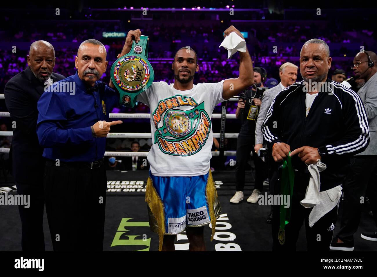Edwin De Los Santos, center, celebrates after winning in a WBC ...