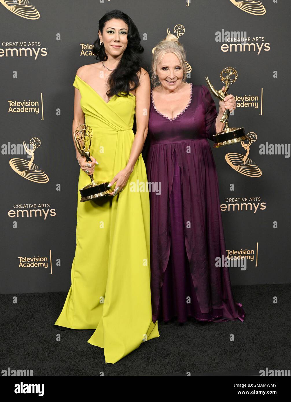 Laura Montgomery, left, and Judy Laukkanen pose with the Emmy for ...