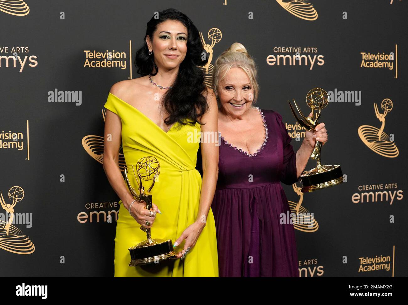 Laura Montgomery, left, and Judy Laukkanen pose in the press room with ...