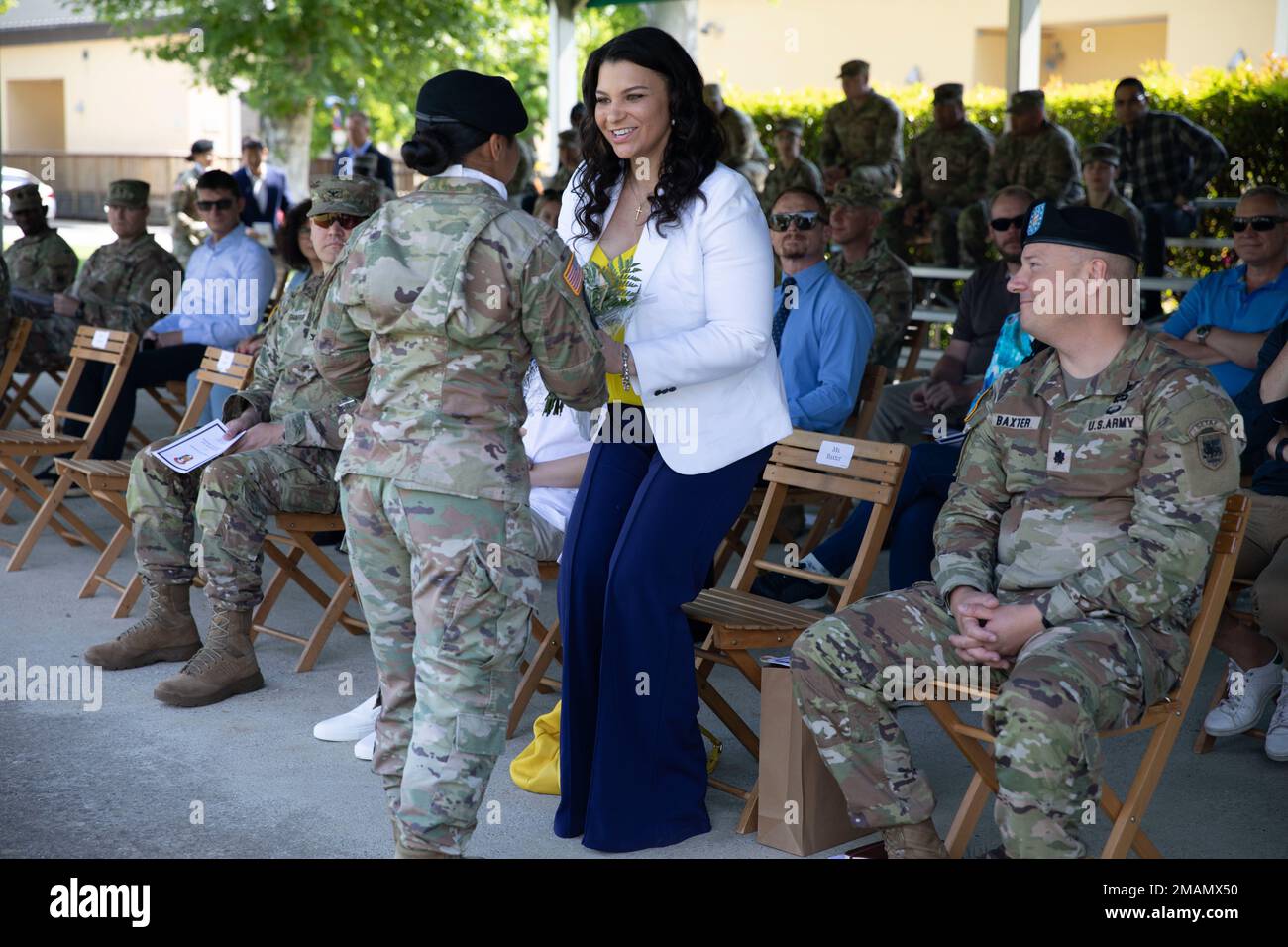Flowers and battalion coins are presented to the family of Lt. Col ...