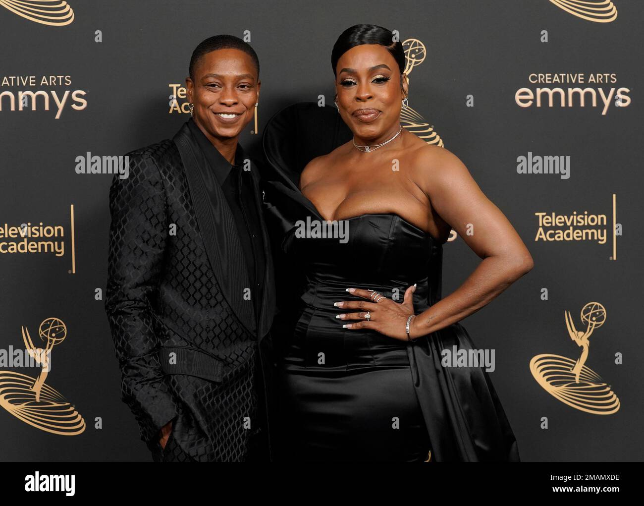 Jessica Betts, left, and Niecy Nash pose in the press room on night two ...