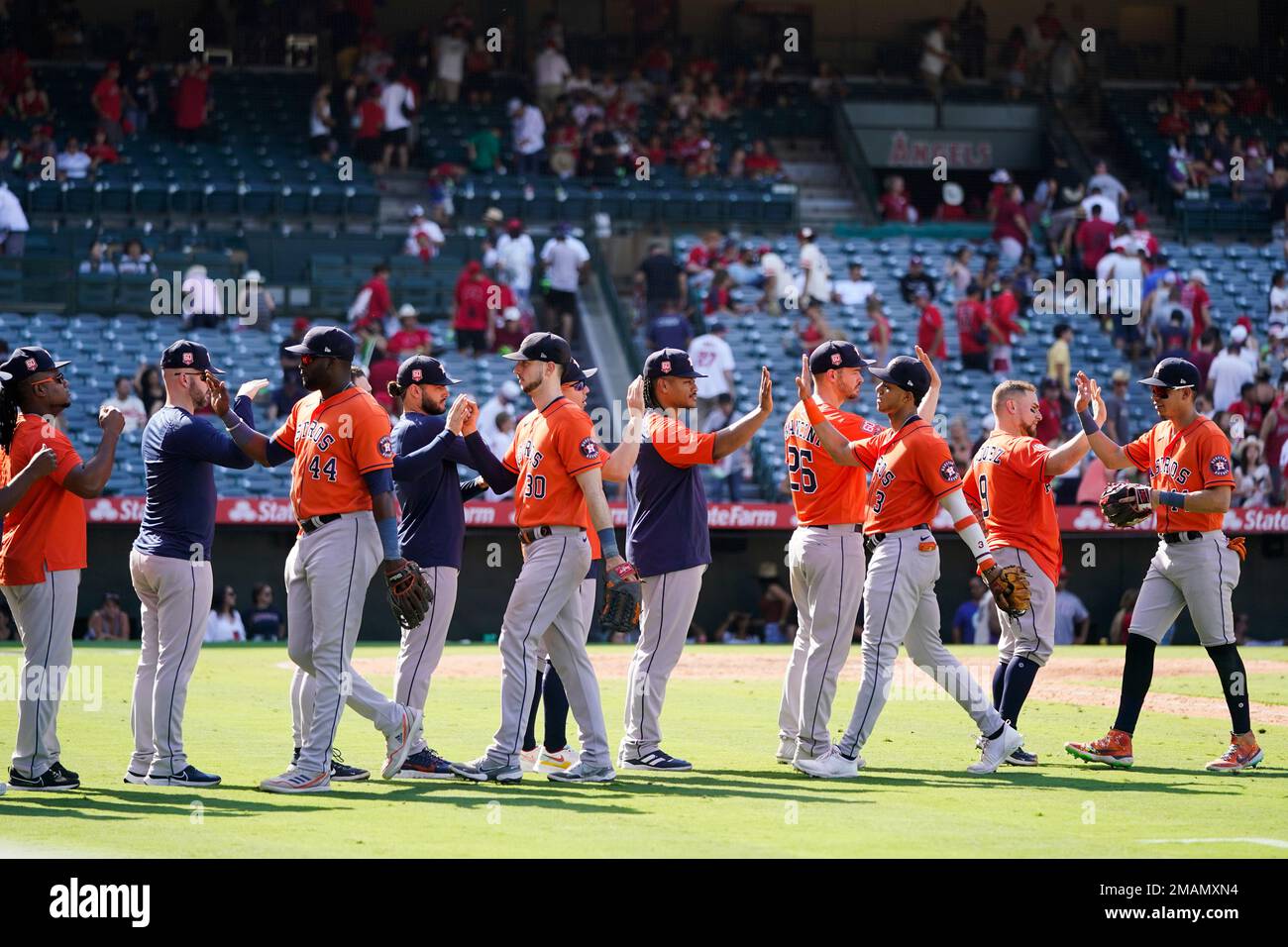 Houston Astros players celebrate their win in a baseball game against ...