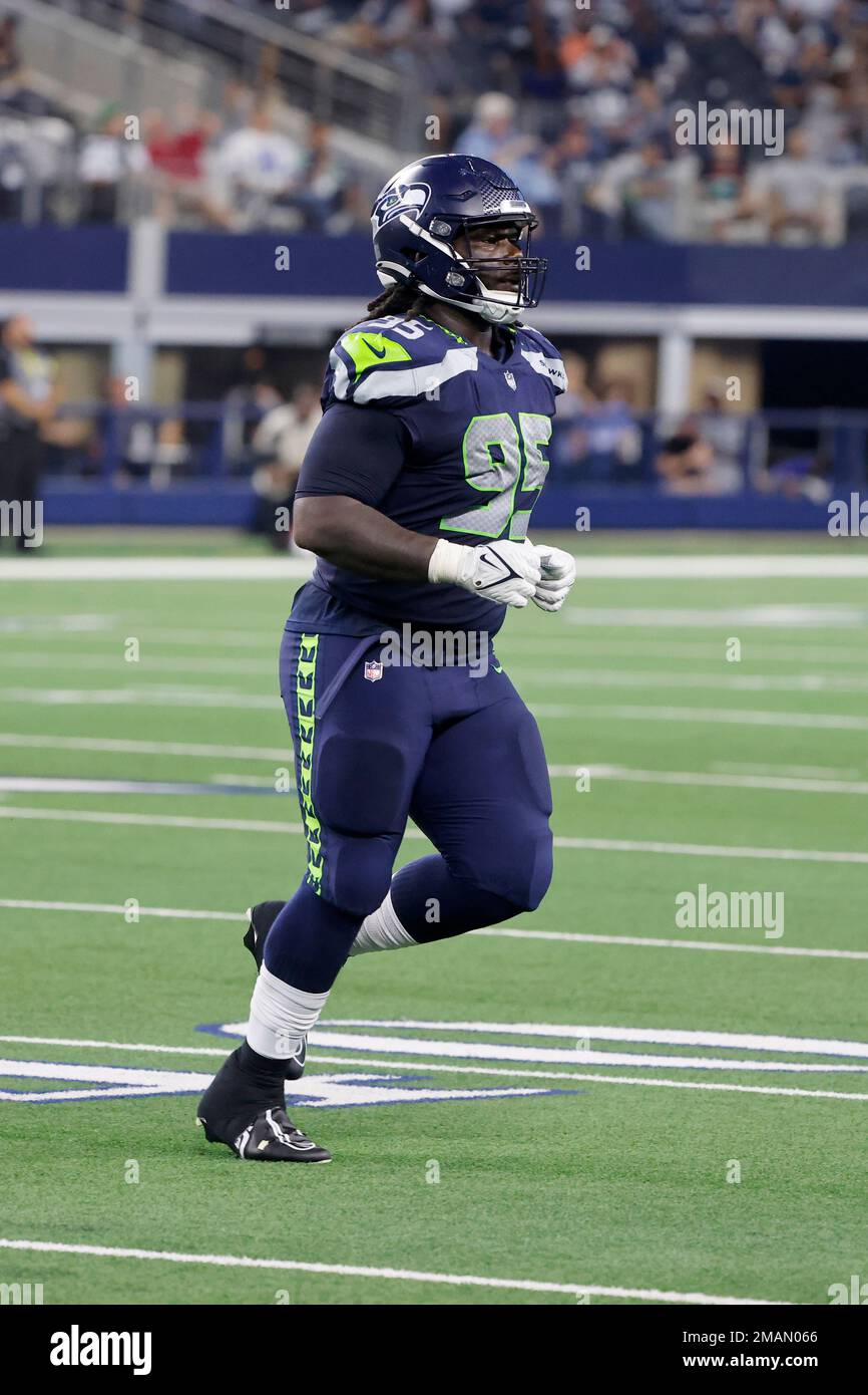 Seattle Seahawks defensive tackle Myles Adams (95) jogs off th field ...