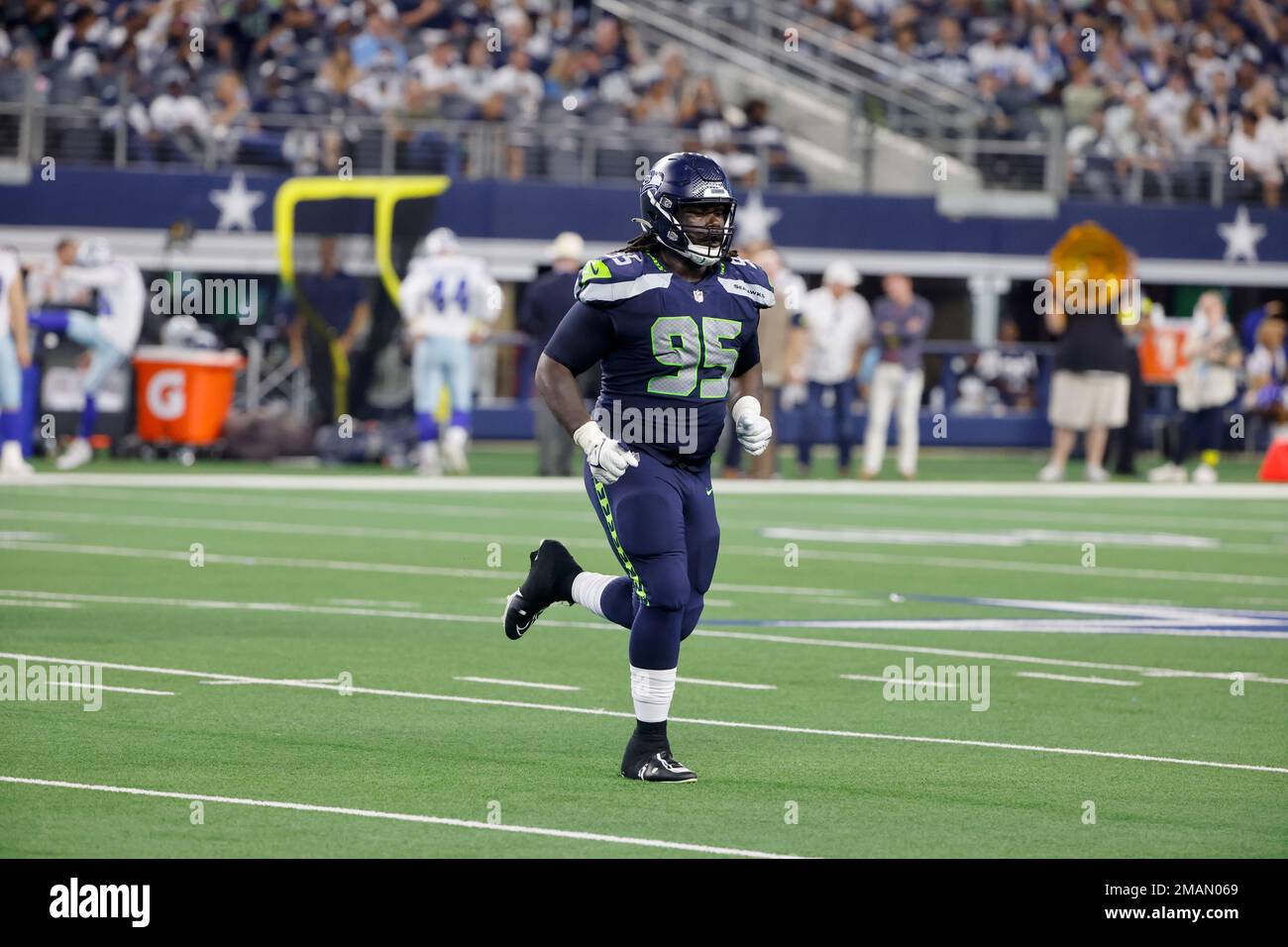 Seattle Seahawks defensive tackle Myles Adams (95) jogs off th field ...