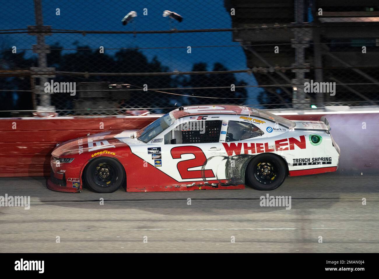 Sheldon Creed brushes against the wall on the final turn of the NASCAR ...