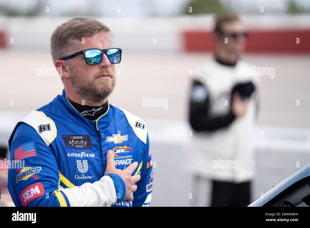 Justin Allgaier stands during the national anthem before the NASCAR ...