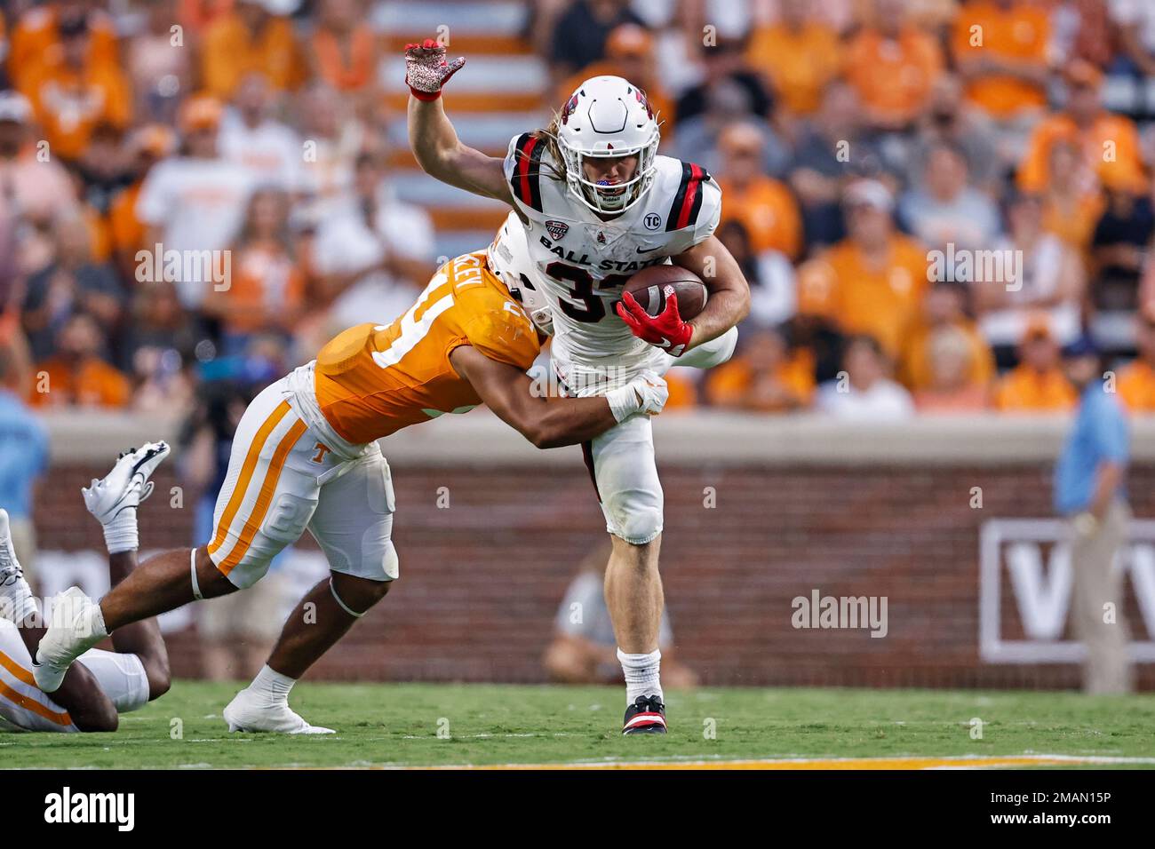 Ball State running back Carson Steele (33) leaps over Tennessee ...
