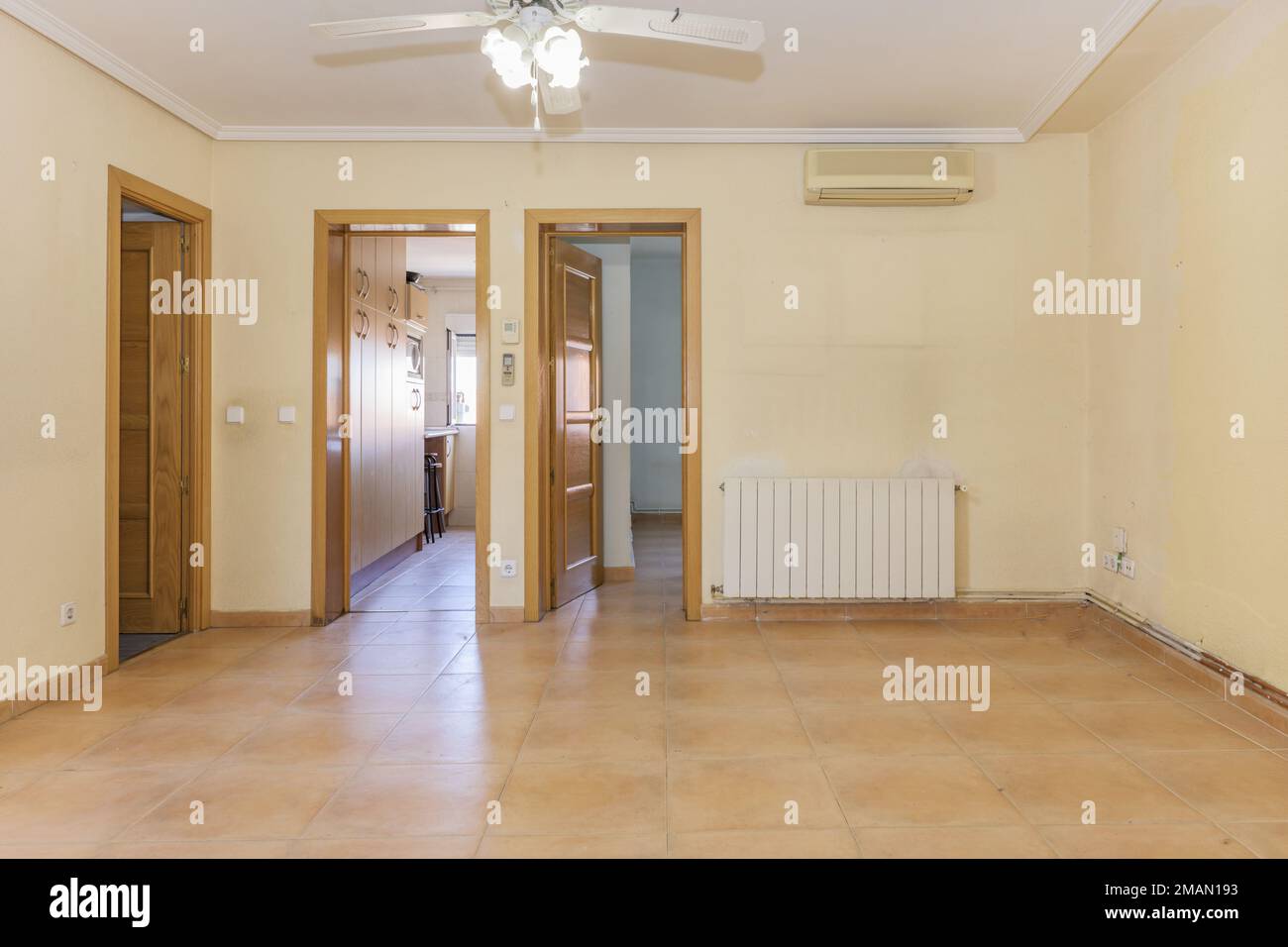 Living room of an empty house with oak wooden doors with light brown ...