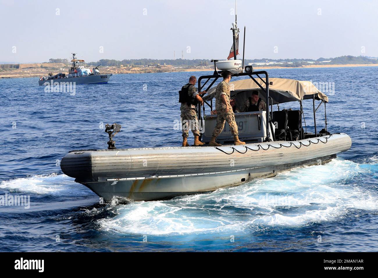 Lebanese Army soldiers patrol near an Israeli Navy vessel during a ...