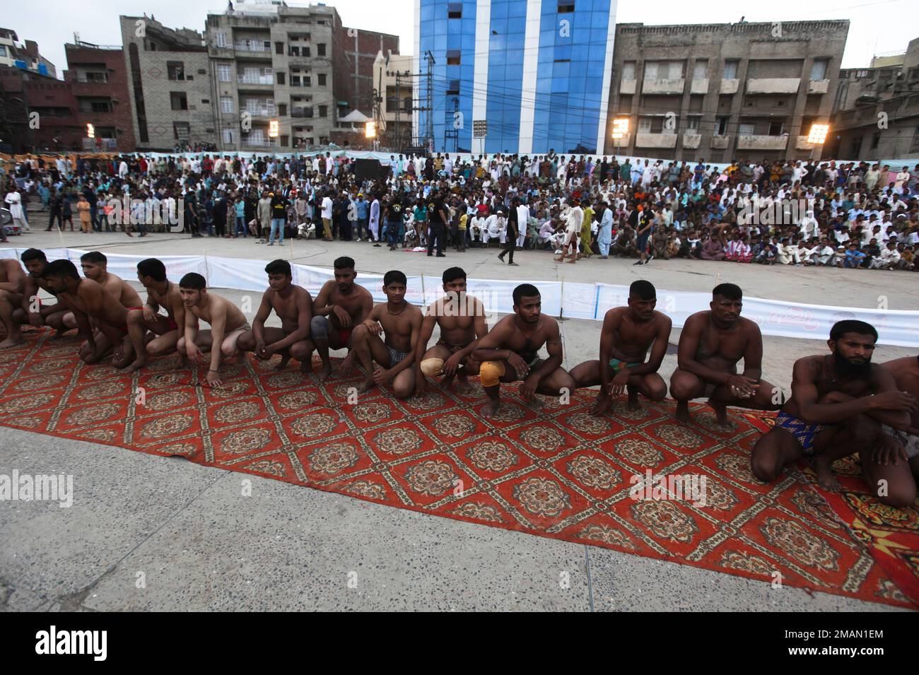 Pakistani Kushti wrestlers wait their turn to participate during Shahi ...