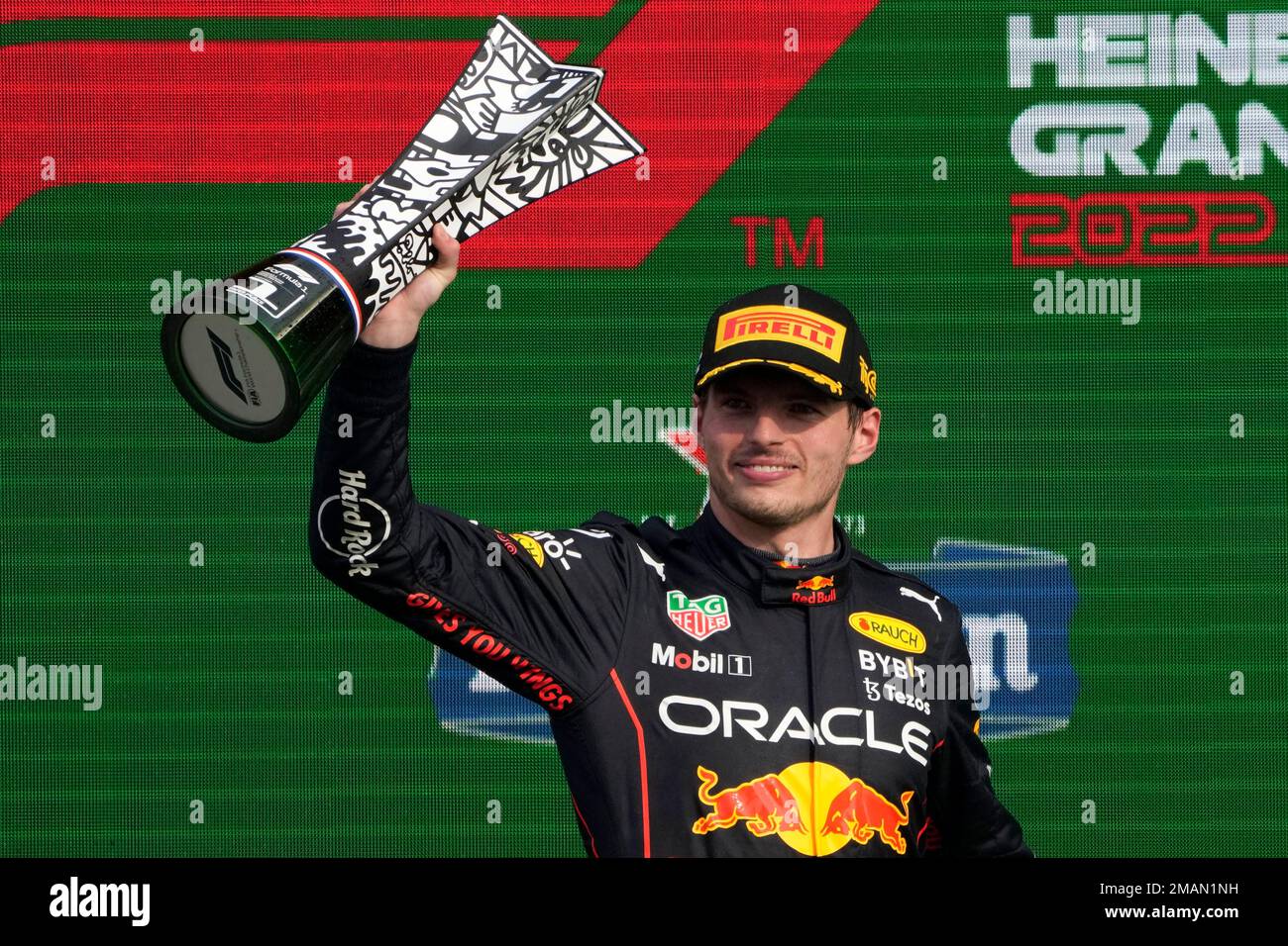 Red Bull driver Max Verstappen of the Netherlands lifts his trophy on ...