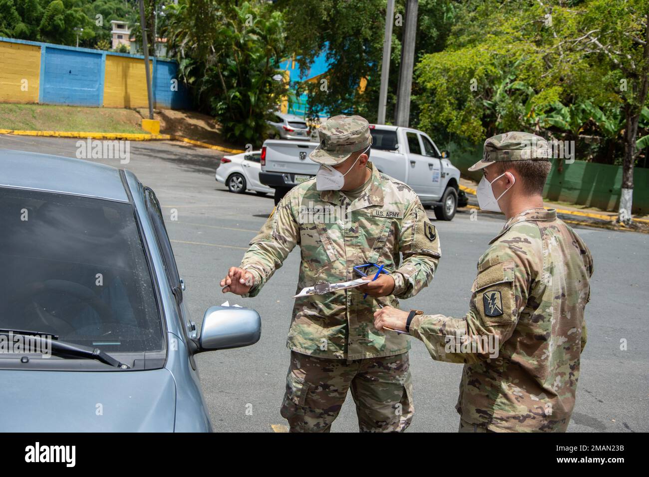 Sgt. Julio Rodríguez (left) of Joint Task Force - Puerto Rico registers ...