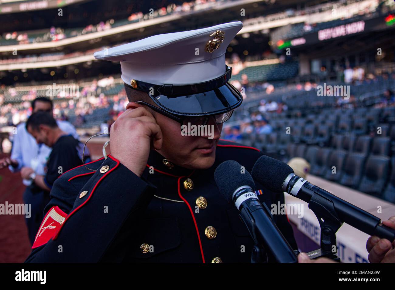 U.S. Marine Corps Lance Cpl. Chris Lucido puts on his earpiece in ...