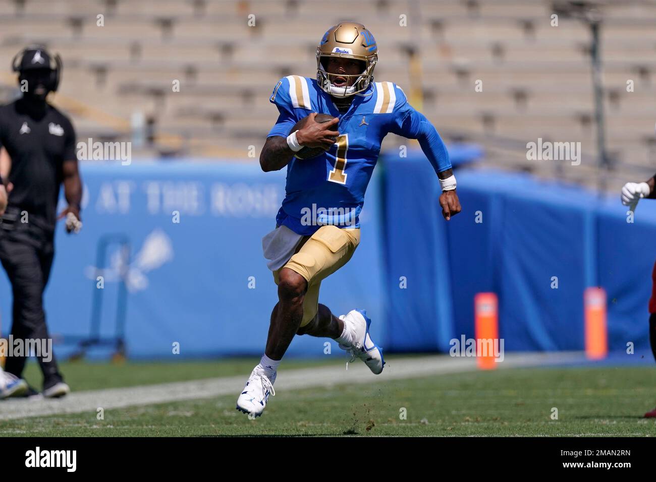 UCLA quarterback Dorian Thompson-Robinson, left, runs for a touchdown ...