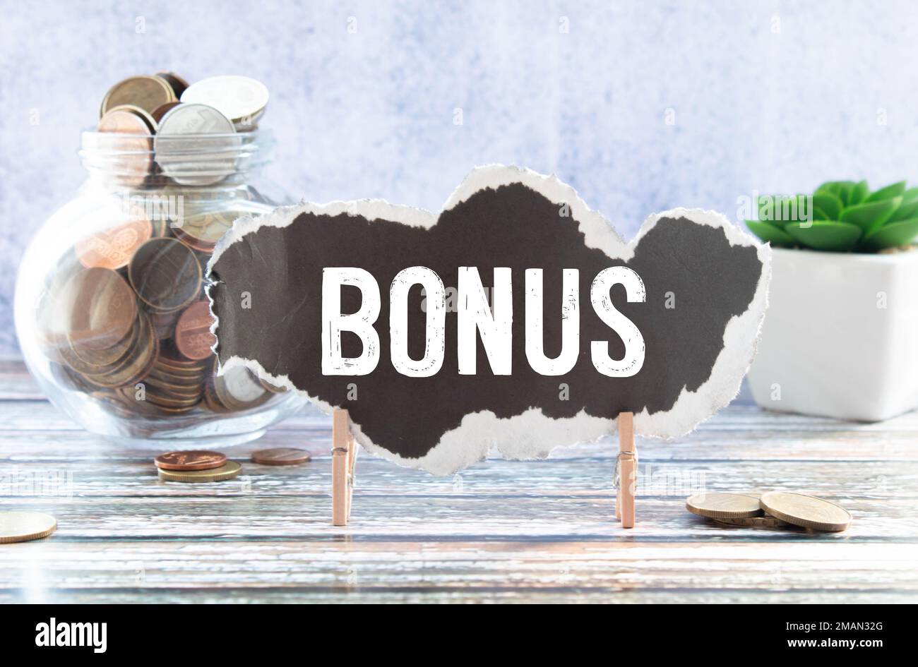 Paper with word Bonds and stacked coins on grey table Stock Photo - Alamy