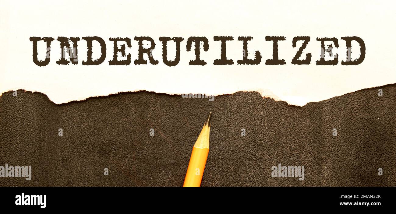 word Underutilized on black background Stock Photo - Alamy